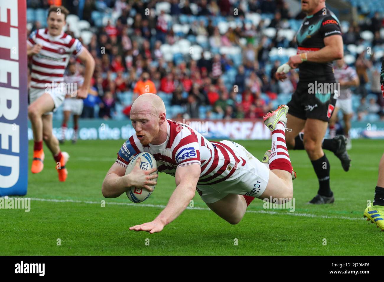 Liam Farrell #12 of Wigan Warriors goes over for a try to make it 12-0 ...