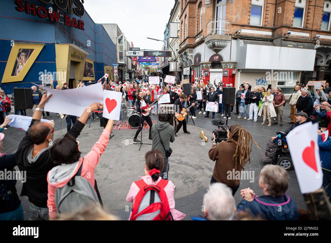 07 May 2022, Hamburg: Numerous fans stand on Beatles Square in Hamburg ...