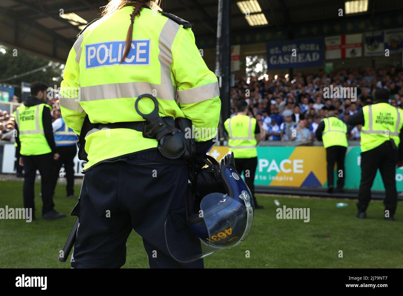 Police line up to prevent fans from invading the pitch during the Sky ...
