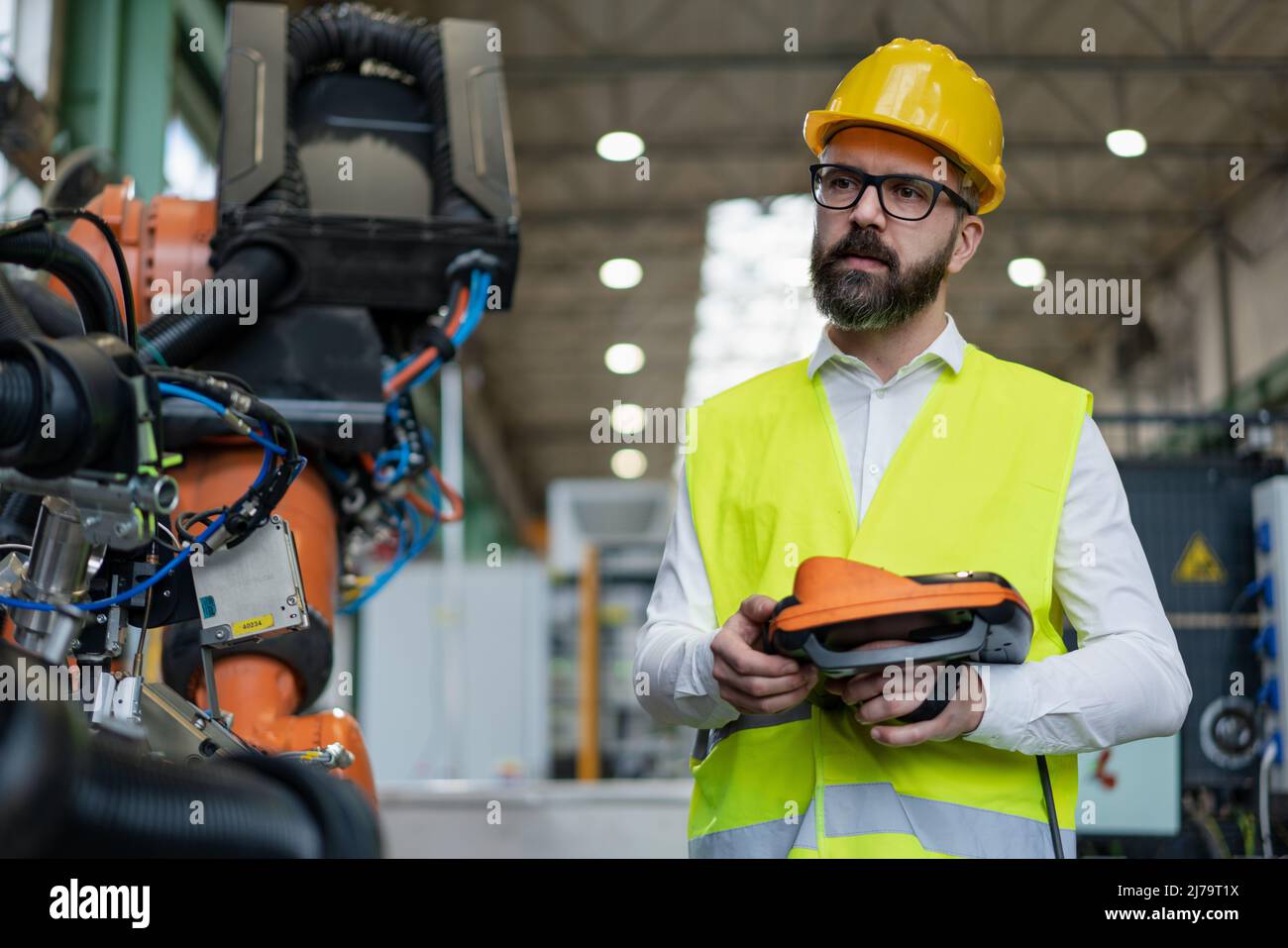 Automation engineer holding scanner in industrial factory Stock Photo ...