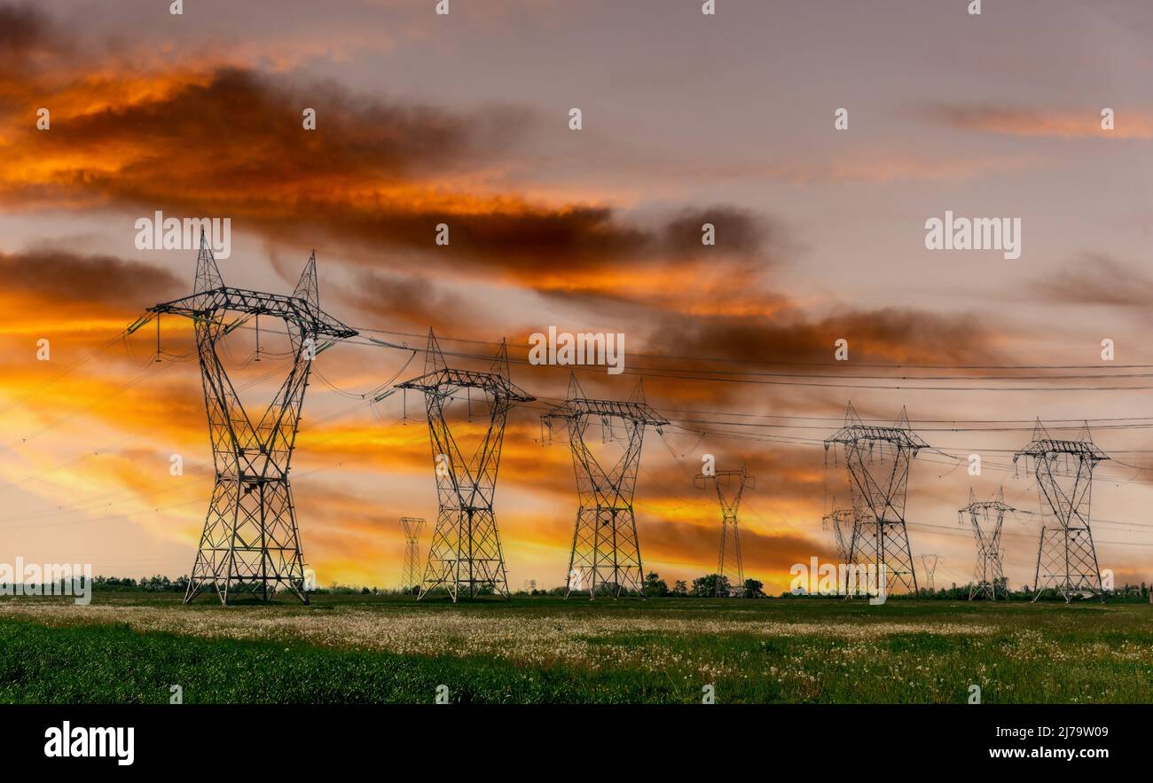 High voltage power lines, high voltage electrical transmission towers ...