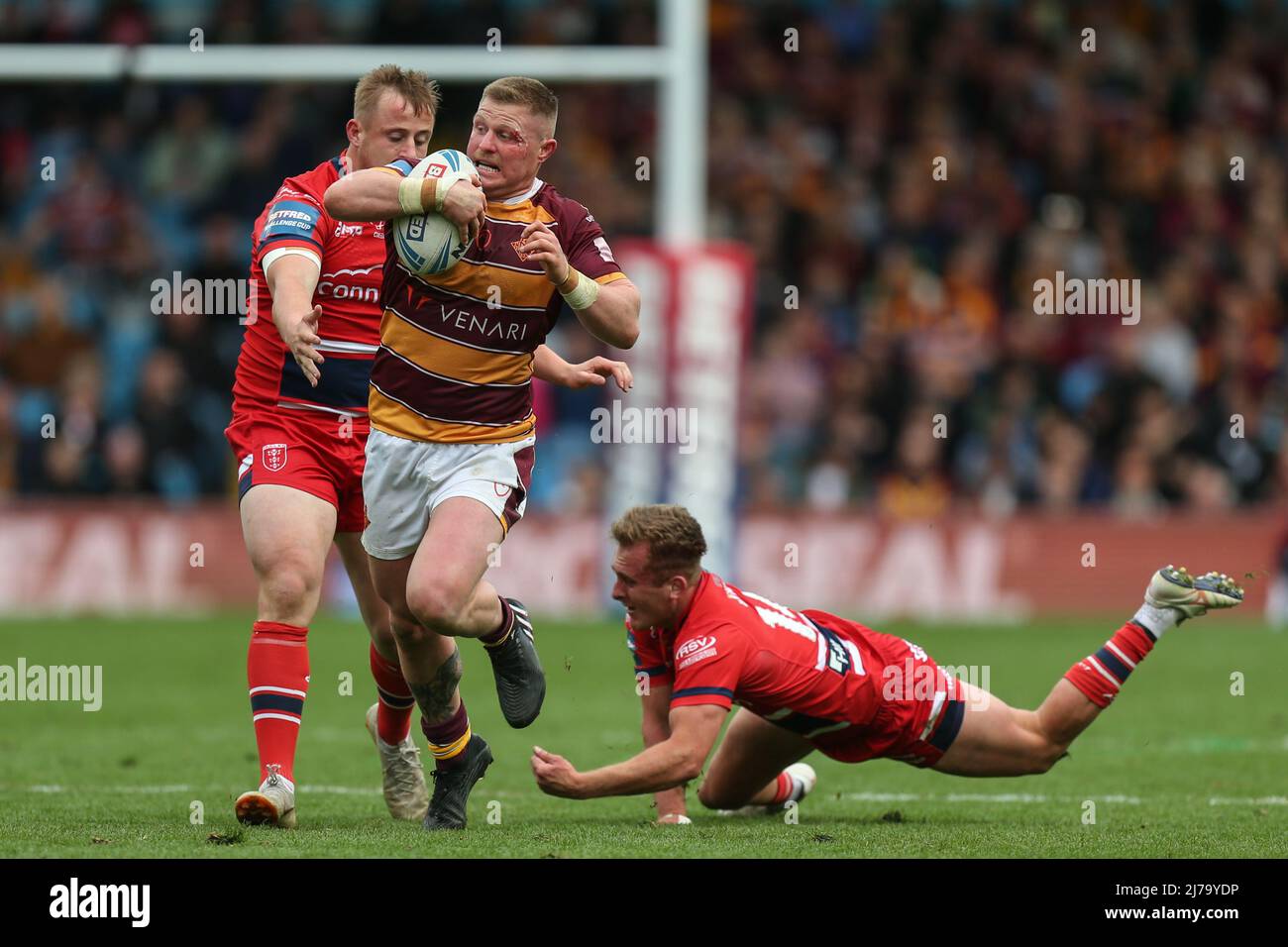 Luke Yates #13 of Huddersfield Giants runs through the Hull KR defence ...