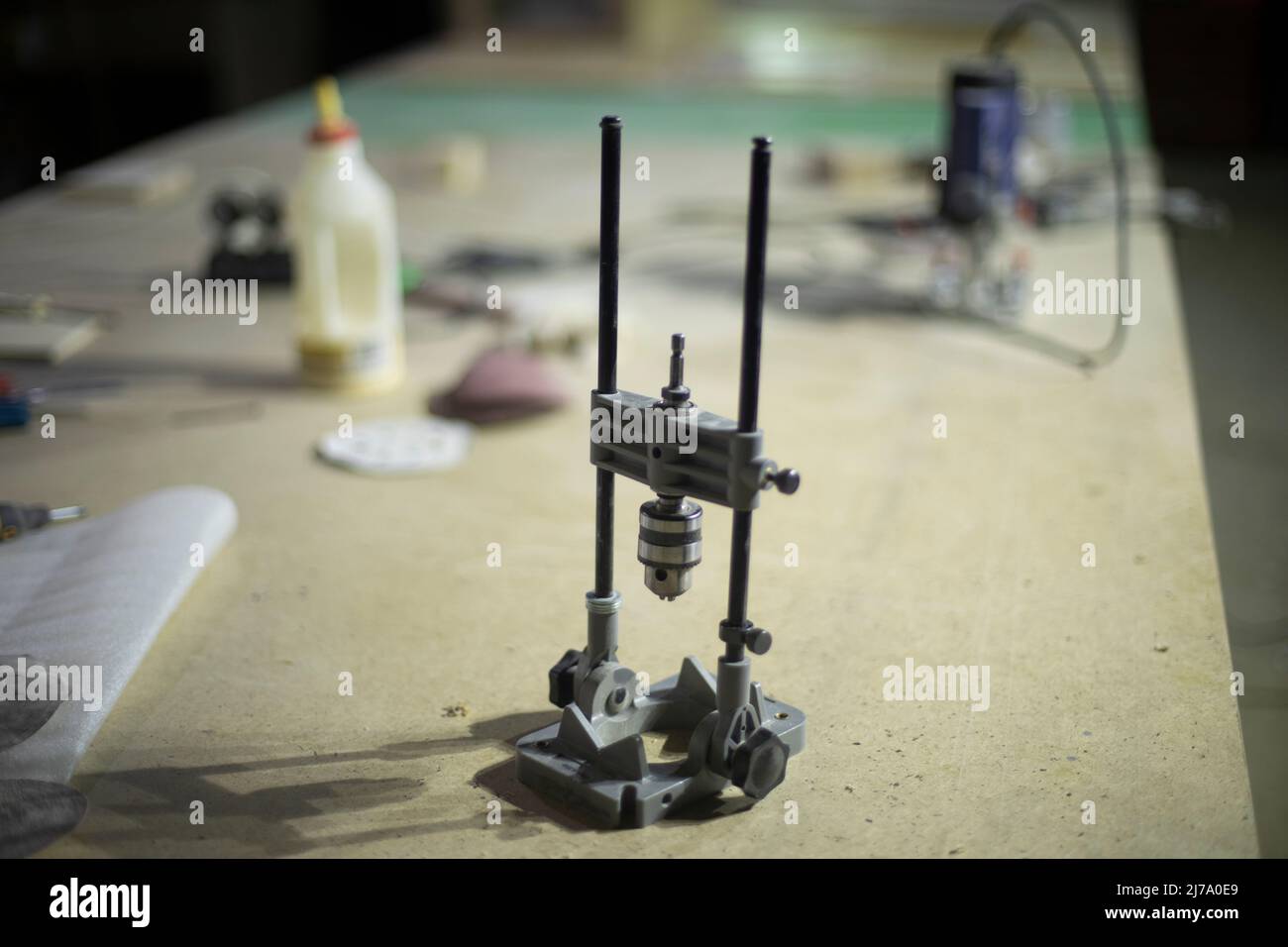 Hand drill on table. Tools in garage. Hole drilling tool. Details of ...