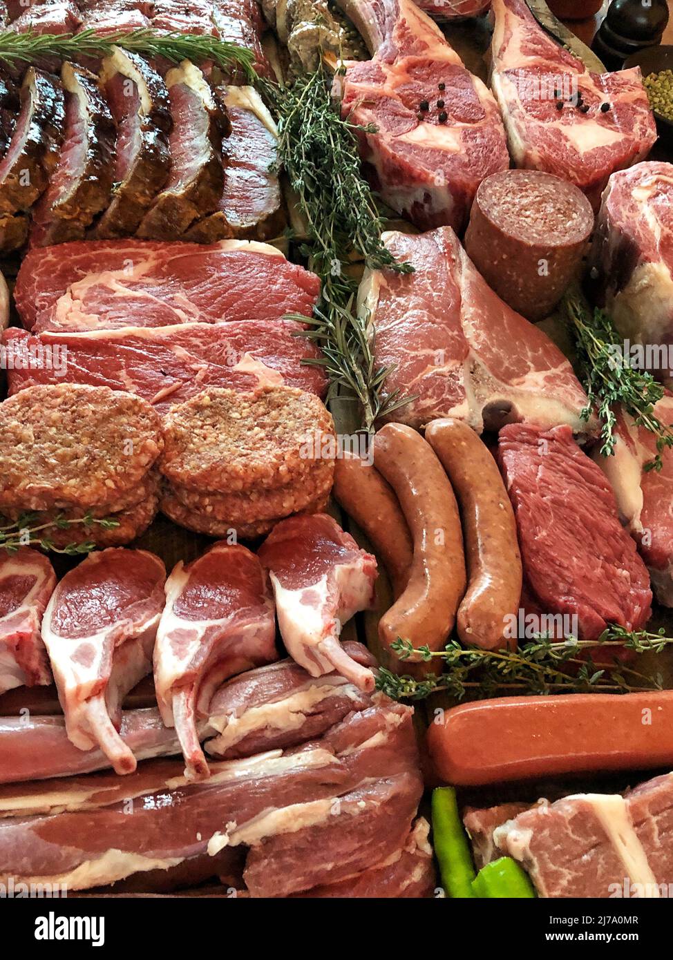 variety of raw meats as a background Stock Photo - Alamy