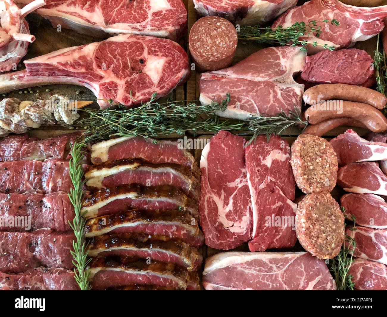 variety of raw meats as a background Stock Photo - Alamy