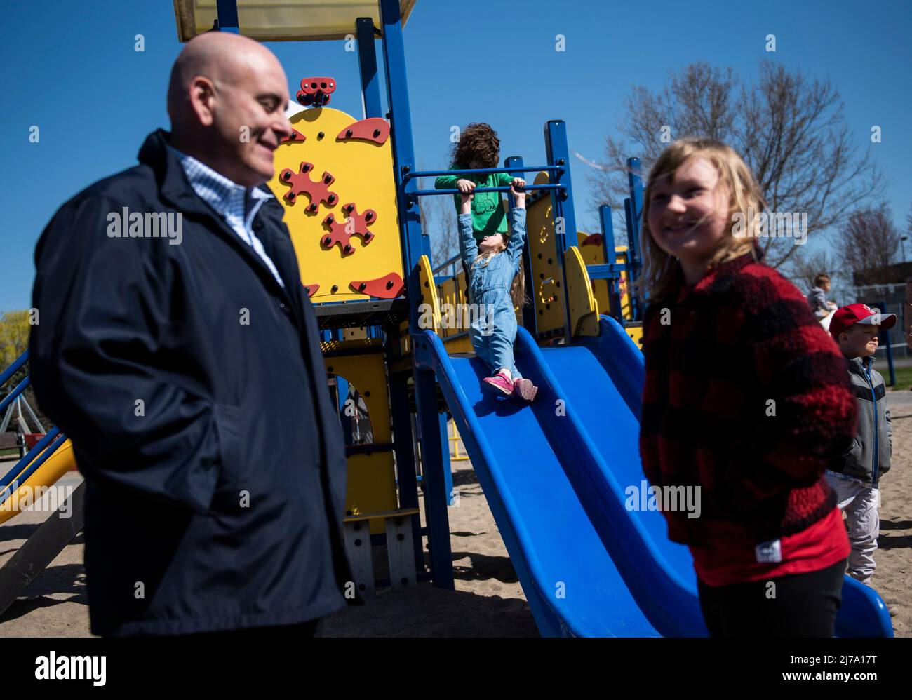 Children play as Ontario Liberal Leader Steven Del Duca speaks to a ...