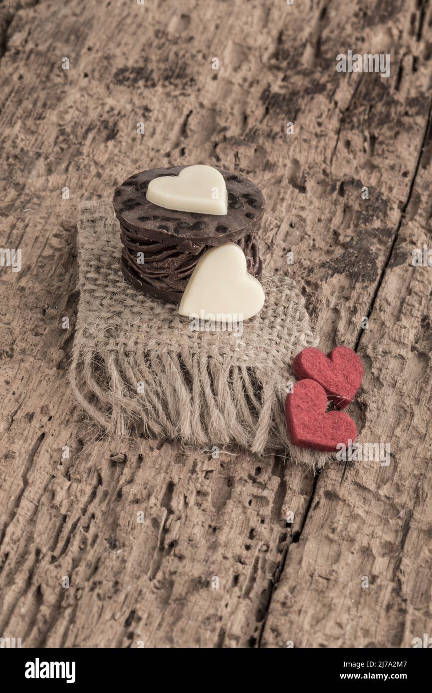 heart shaped chocolate bars and red hearts on wooden table Stock Photo ...