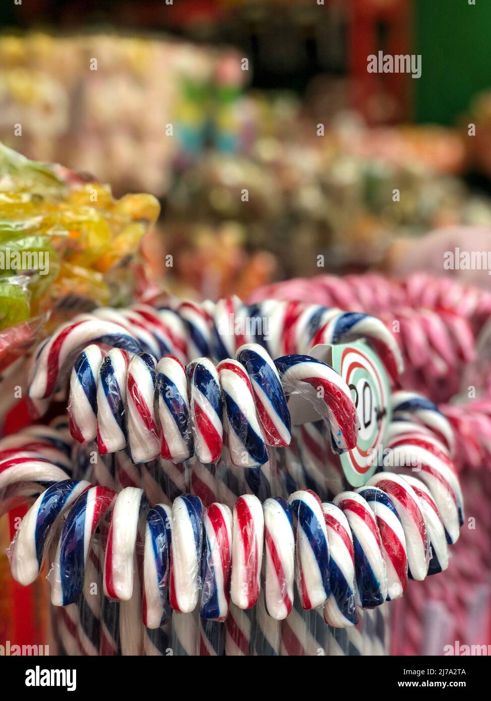 colorful stick candies on shelf in a noel market Stock Photo - Alamy