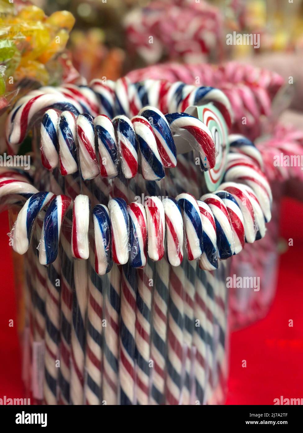 colorful stick candies on shelf in a noel market Stock Photo - Alamy