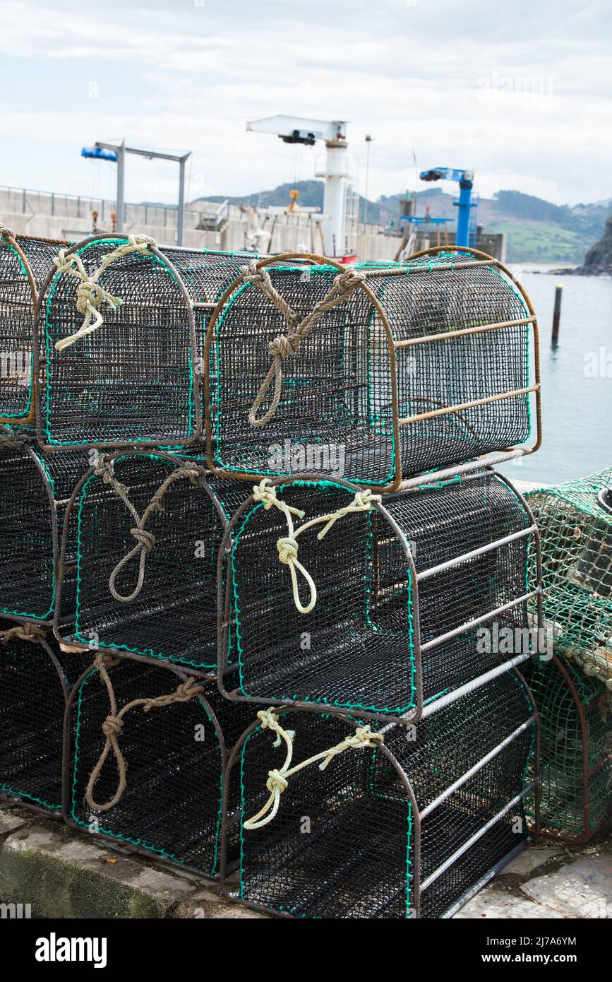 Tower of empty fishing cages in a row. Tazones harbor, Asturias. Spain ...