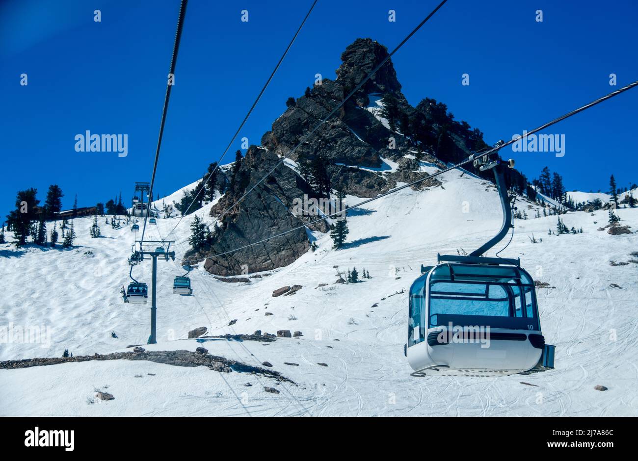 Gondola lift going up at the Snowbasin Ski Resort in Utah Stock Photo ...