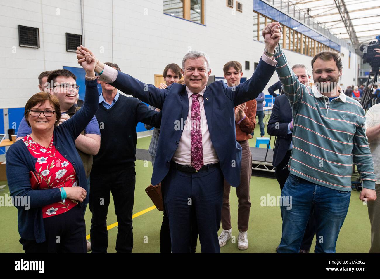 SDLP's Patsy McGlone celebrates (centre) with supporters as he is ...