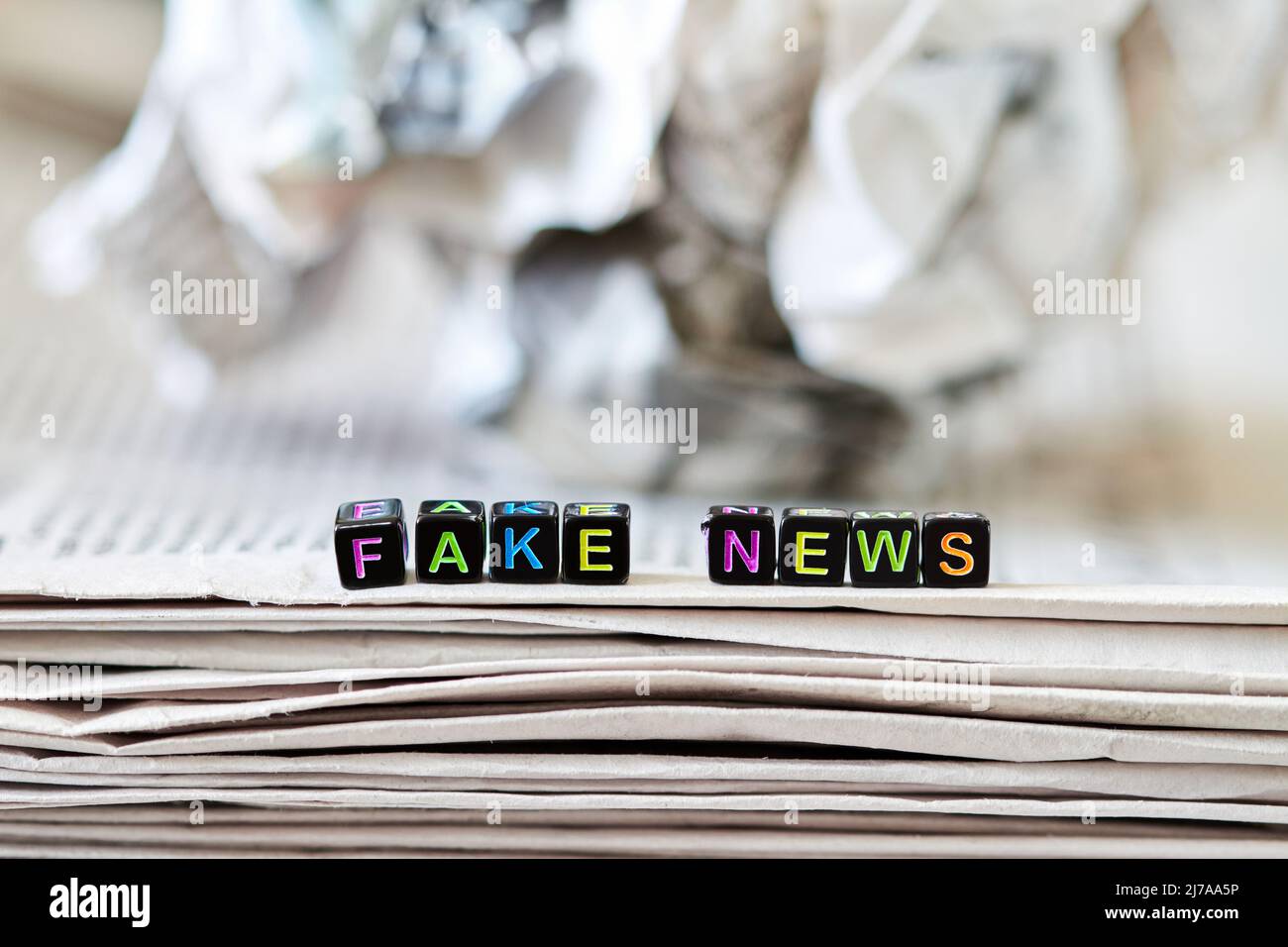 The inscription Fake news on the stack of newspapers on the background ...