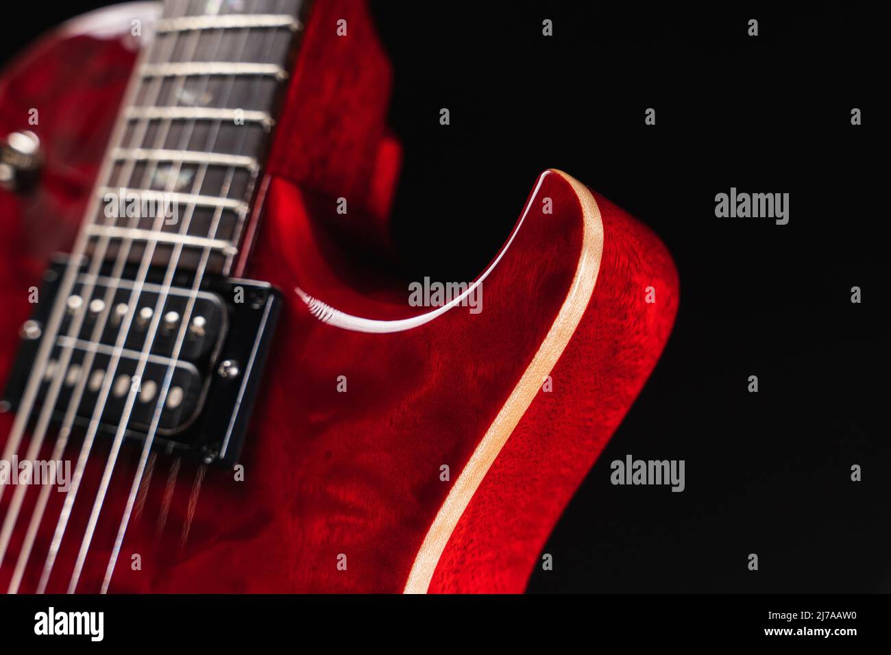 Closeup of red, glossy electric guitar Stock Photo - Alamy