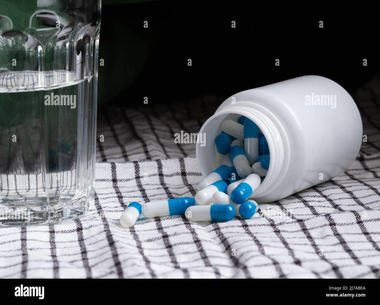Time to take your medicine. Pill reminder. Tablets and alarm clock ...