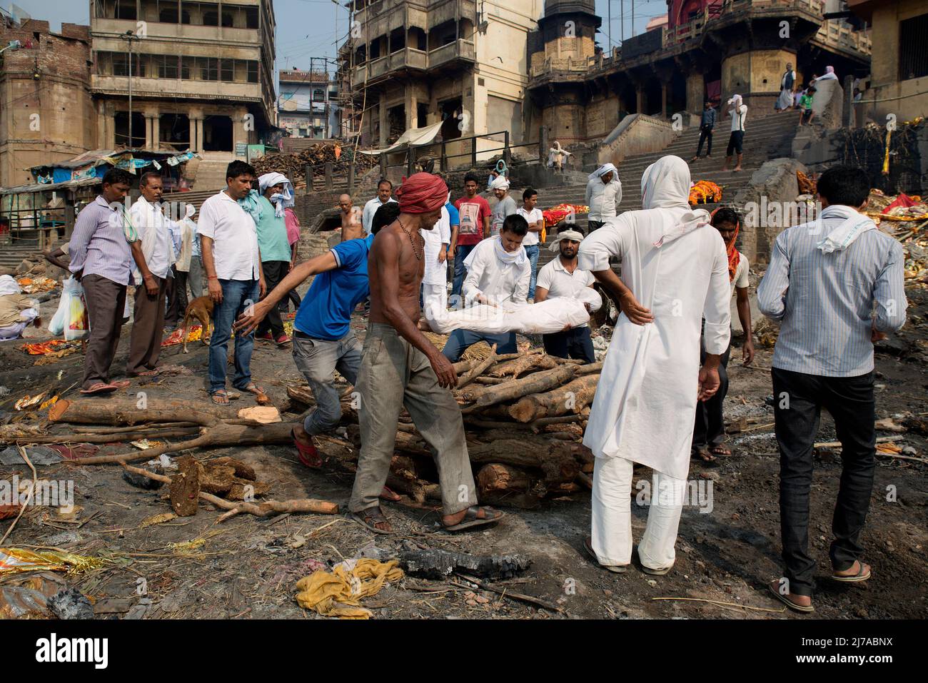 A corpse is being brought to be lain on a pyre for cremation at ...