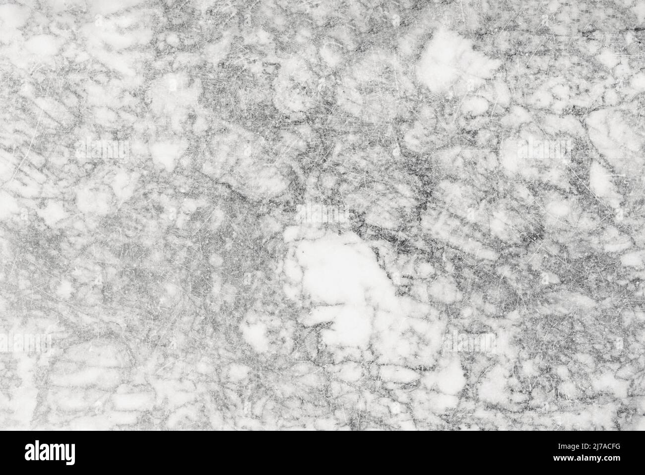 The texture of natural white marble made of natural tiles is a ...