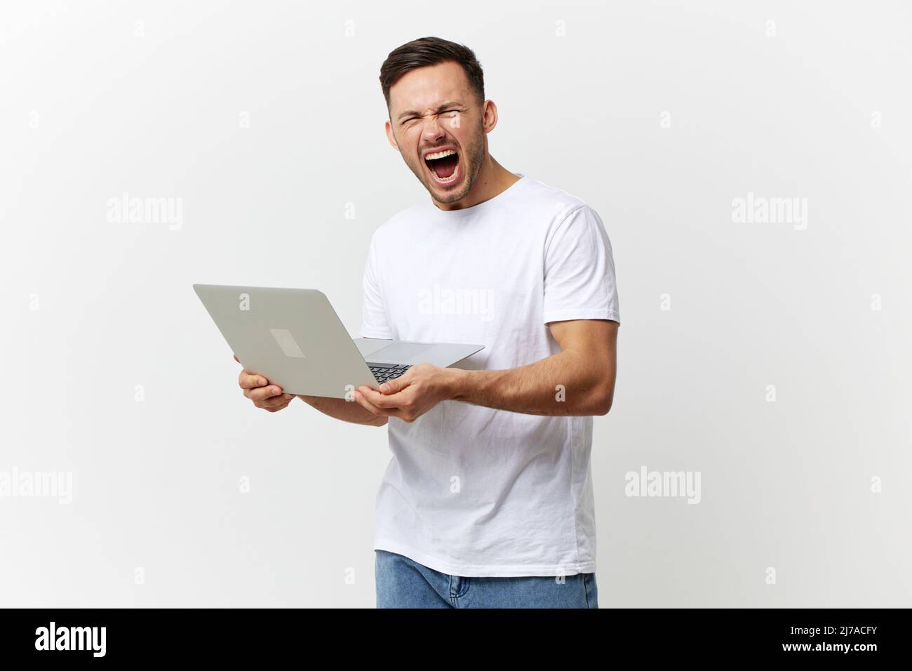 Aggressive angry crazy tanned handsome man in basic t-shirt scream at ...