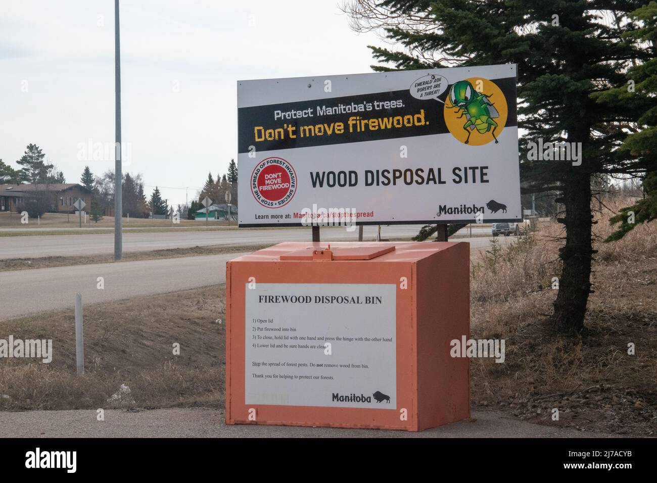 Firewood disposal bin and sign to stop the spread of forest invasive ...
