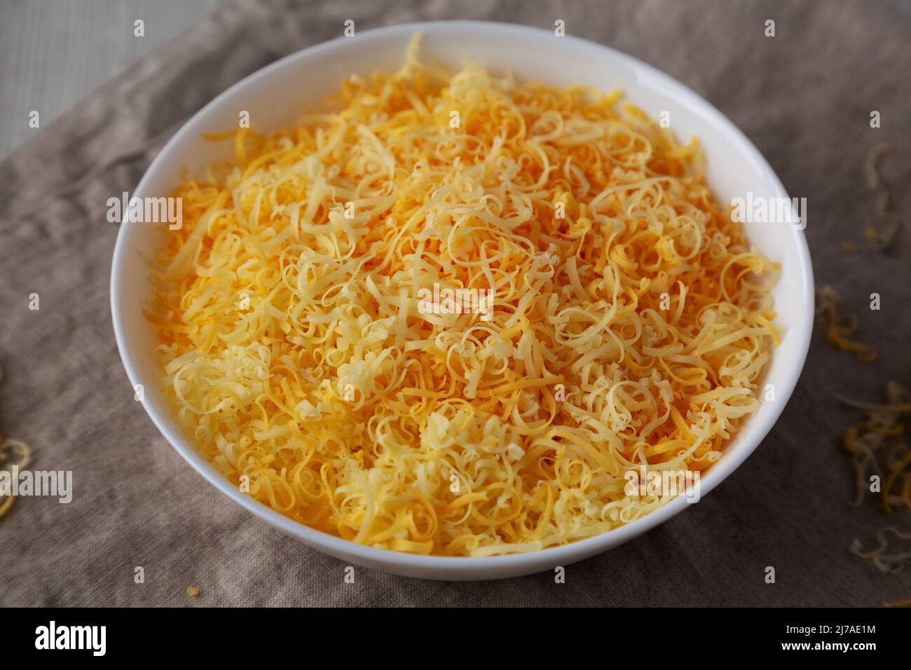 Bright shredded cheddar cheese hi-res stock photography and images - Alamy