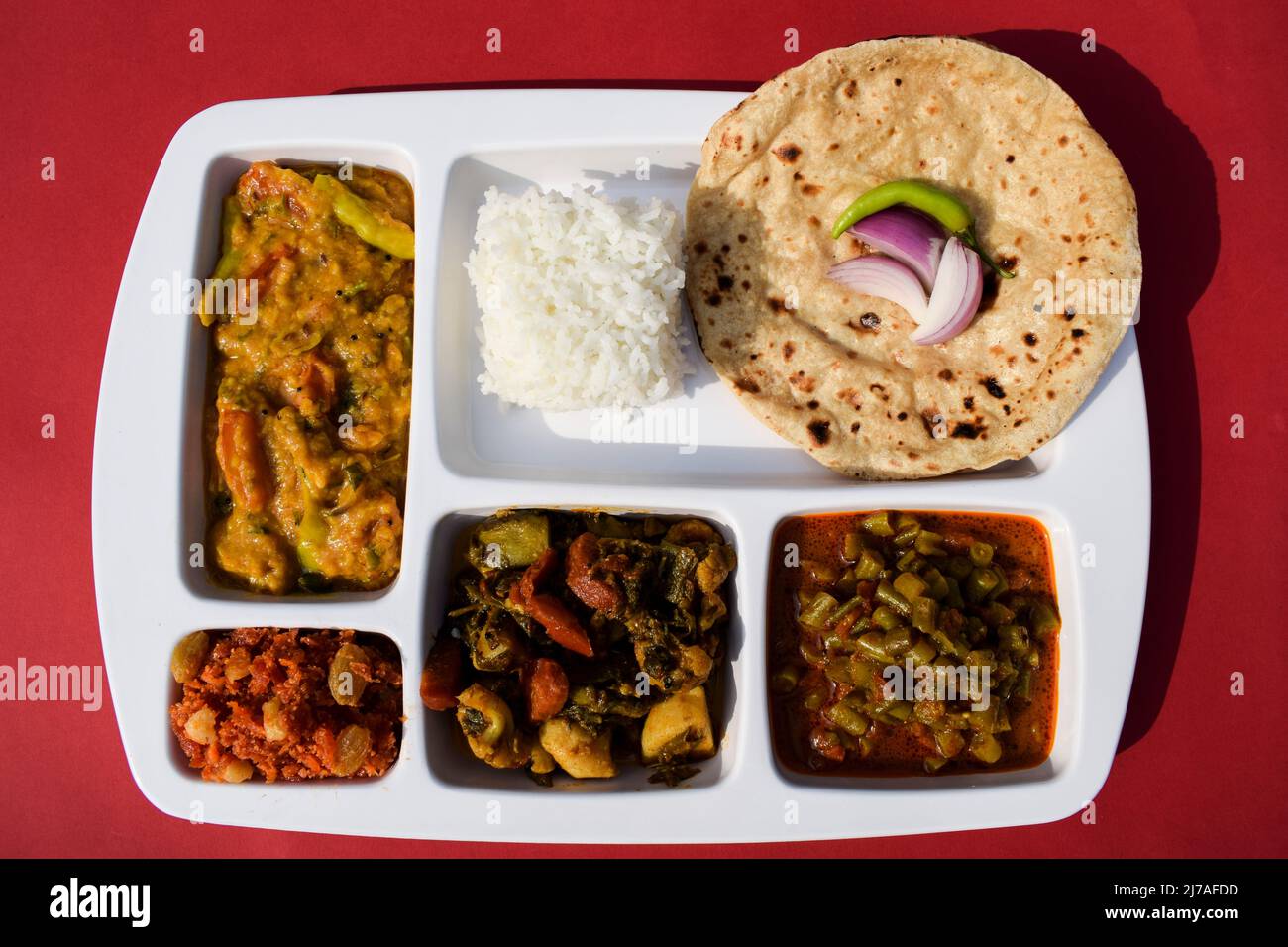 Indian Simple homemade lunch of Roti, sabji with mix veg brinjal potato ...