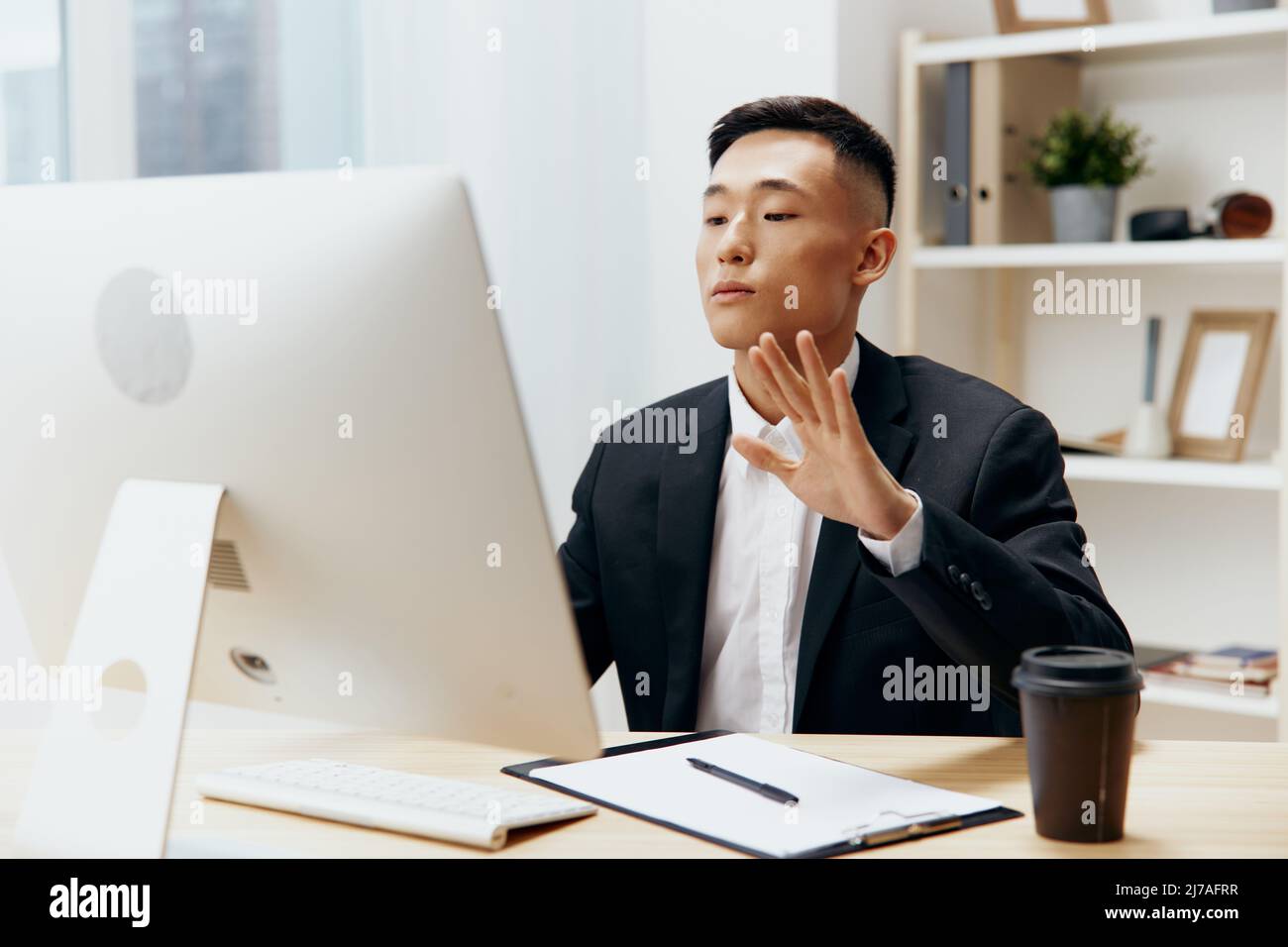 man sitting at a desk in front of a computer emotions technologies ...