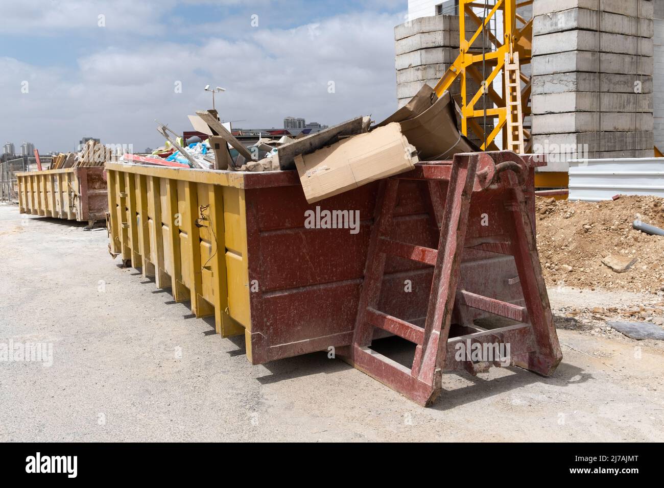 huge heap on metal Big Overloaded dumpster waste container filled with ...