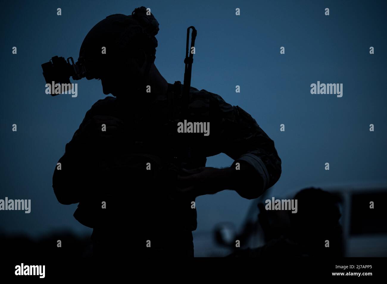 A U.S. Army Special Forces member conducts a communications check ...