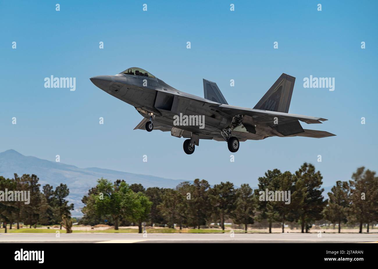 An F-22 Raptor assigned to the 433rd Weapons Squadron, U.S. Air Force ...