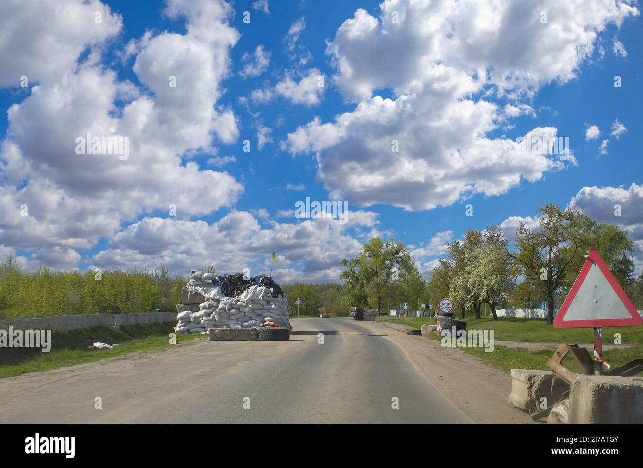 Russian-Ukrainian war. Roadblock with flag Stock Photo - Alamy