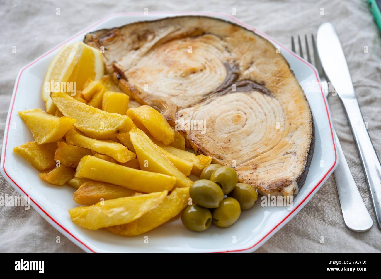 Seafood dish, grilled steak from swordfish or spada served with french ...