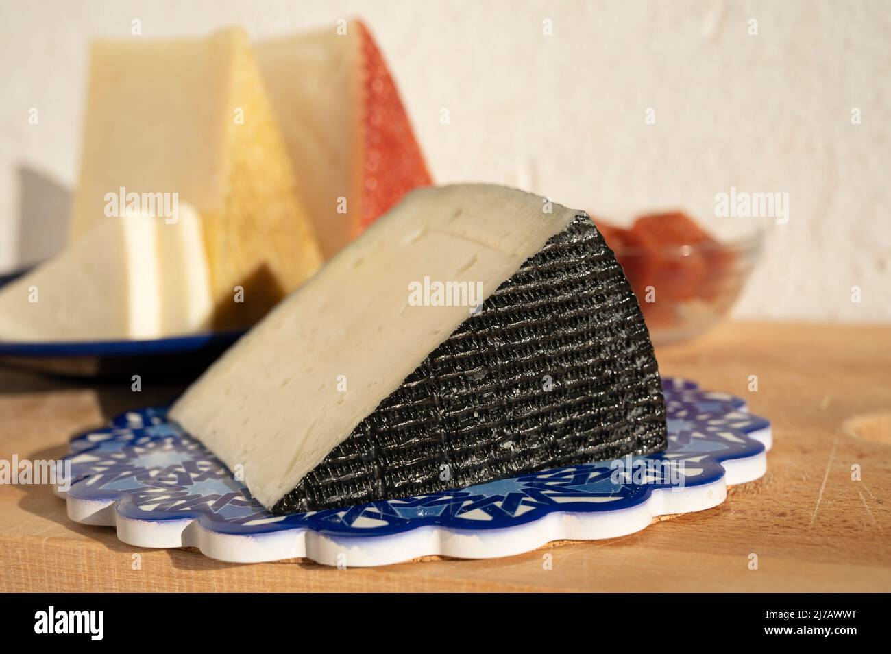 Spanish hard manchego, cow, sheep and goat cheeses served outdoor with ...