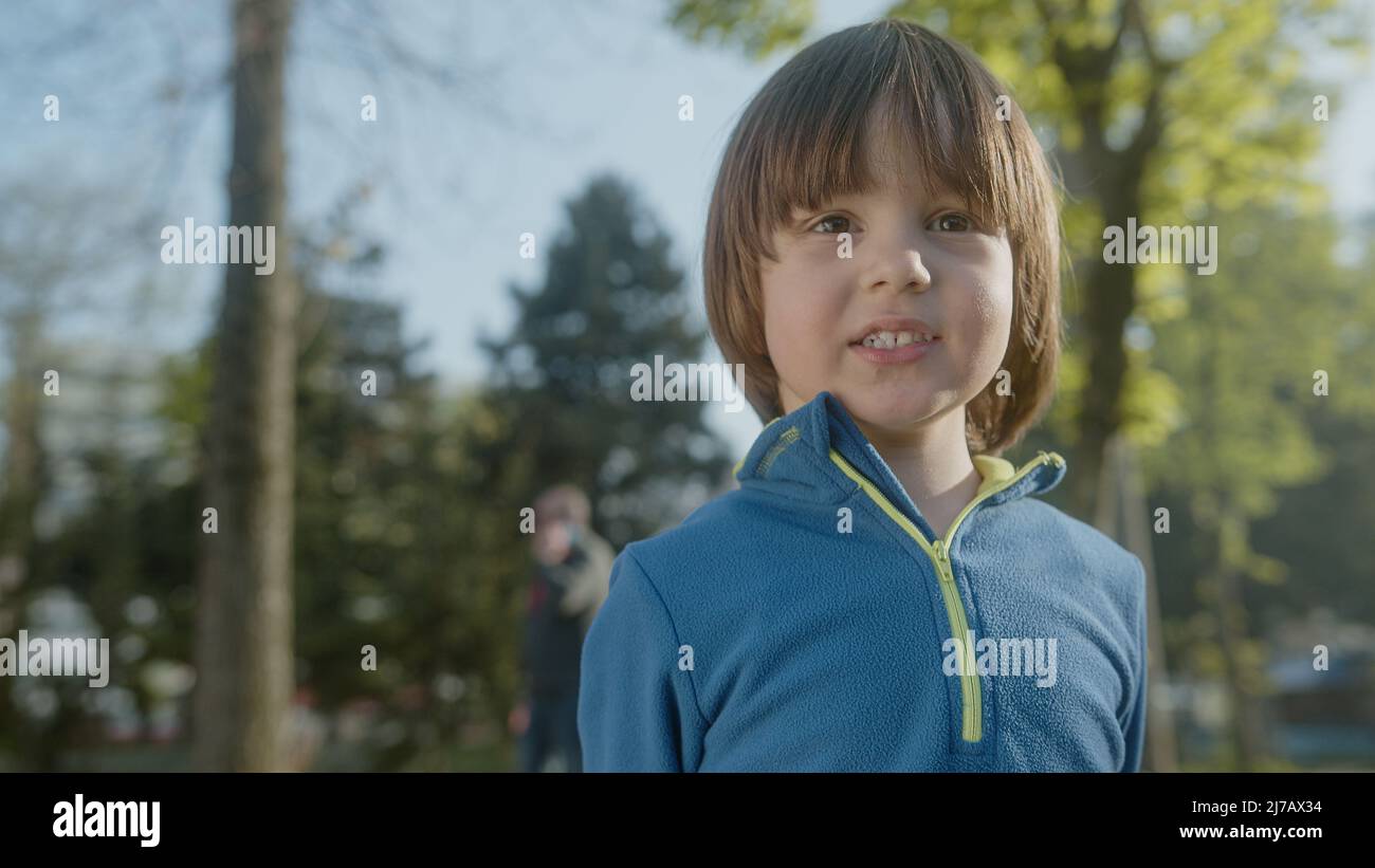 Little cute boy posing portrait looking at camera and smiling ...