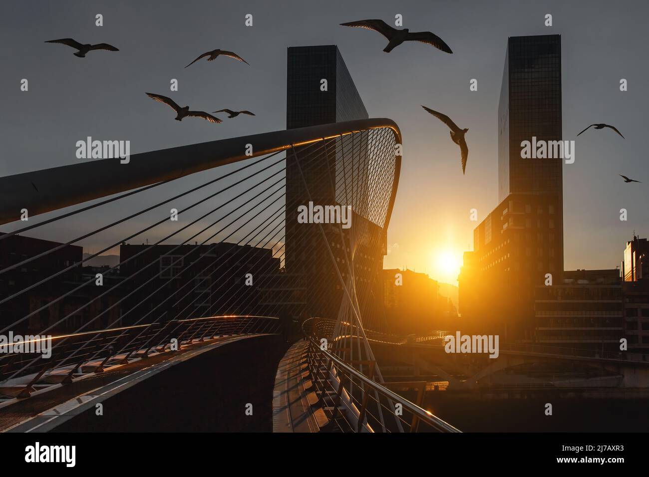 Zubizuri Bridge and Isozaki Towers at sunset, Bilbao, Spain Stock Photo ...