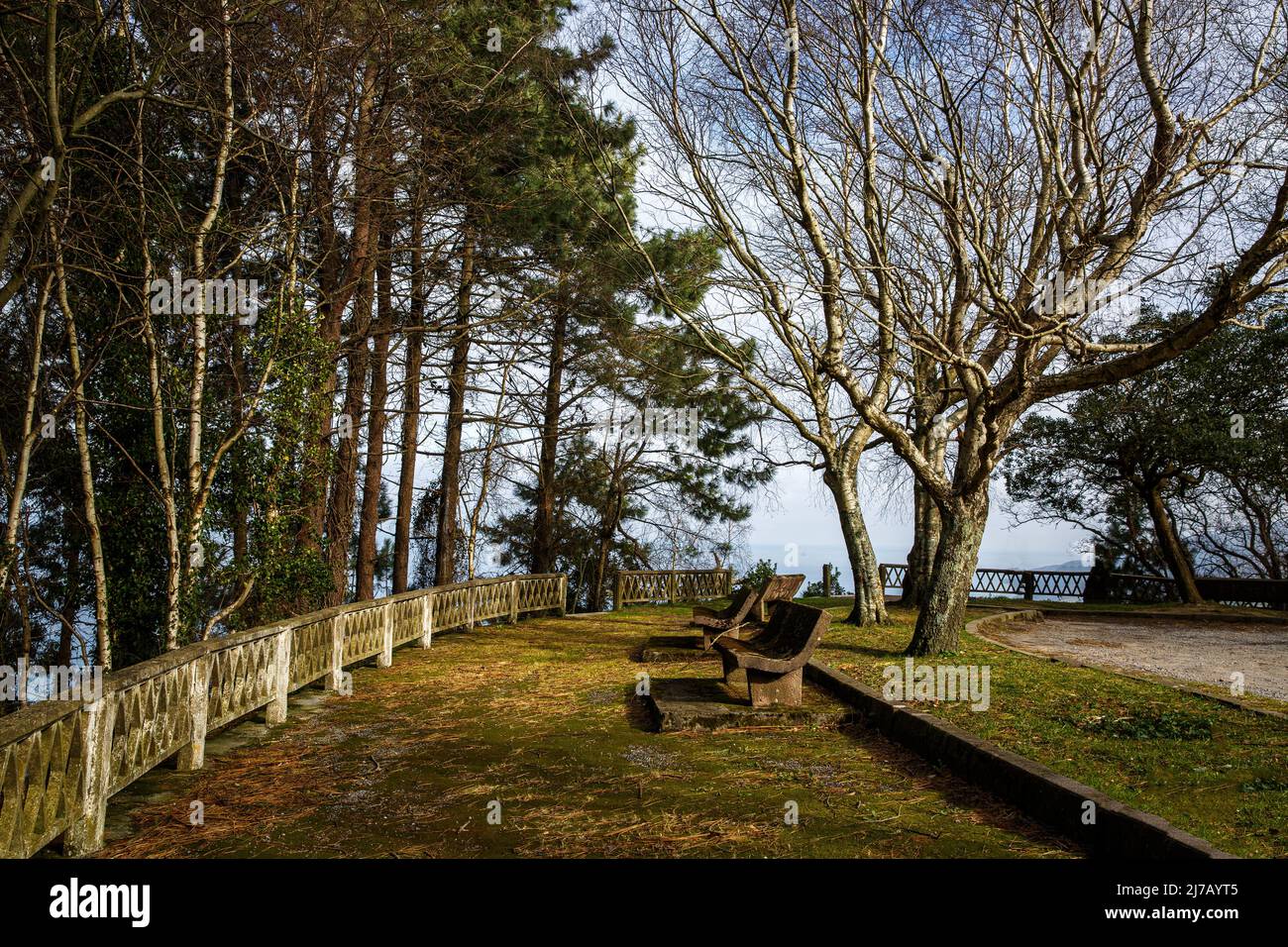 The stone benches are on a beautiful viewpoint in Spain. Mirador in the ...