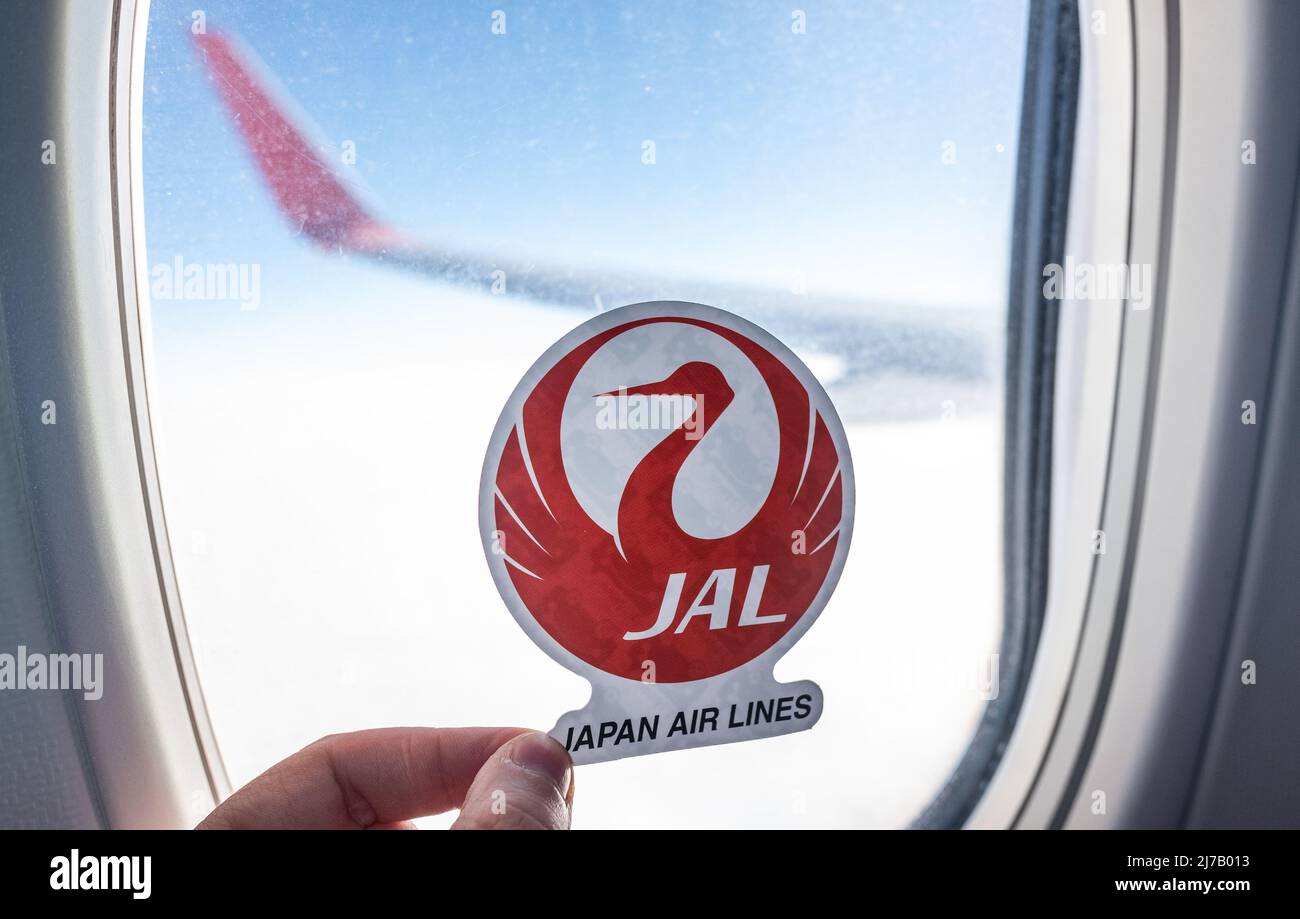 December 6, 2021, Tokyo, Japan. Emblem of Japan Airlines against the ...