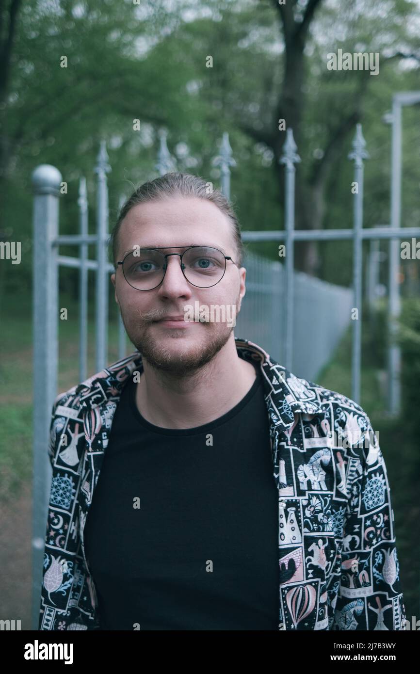 Headshot of attractive serious Caucasian male with thick ginger beard ...