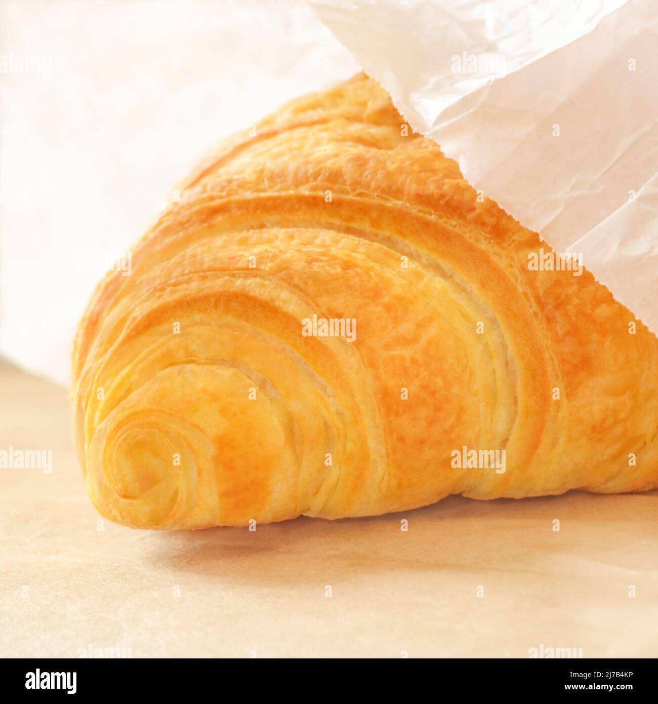 Part of a croissant on a blurred background in a square format Stock ...