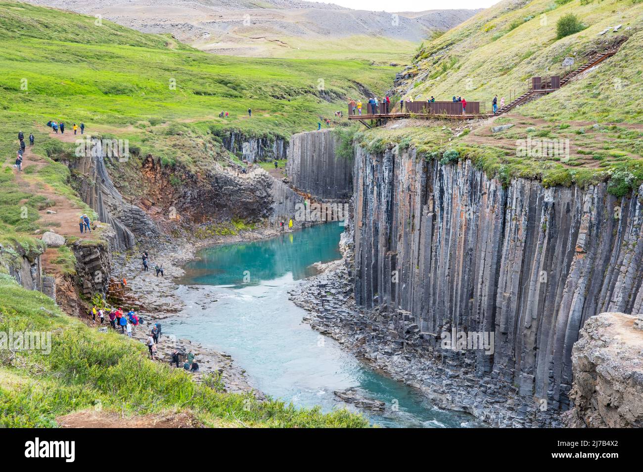 Studlagil Iceland - July 16. 2021: Tourists enjoying the stunning view ...