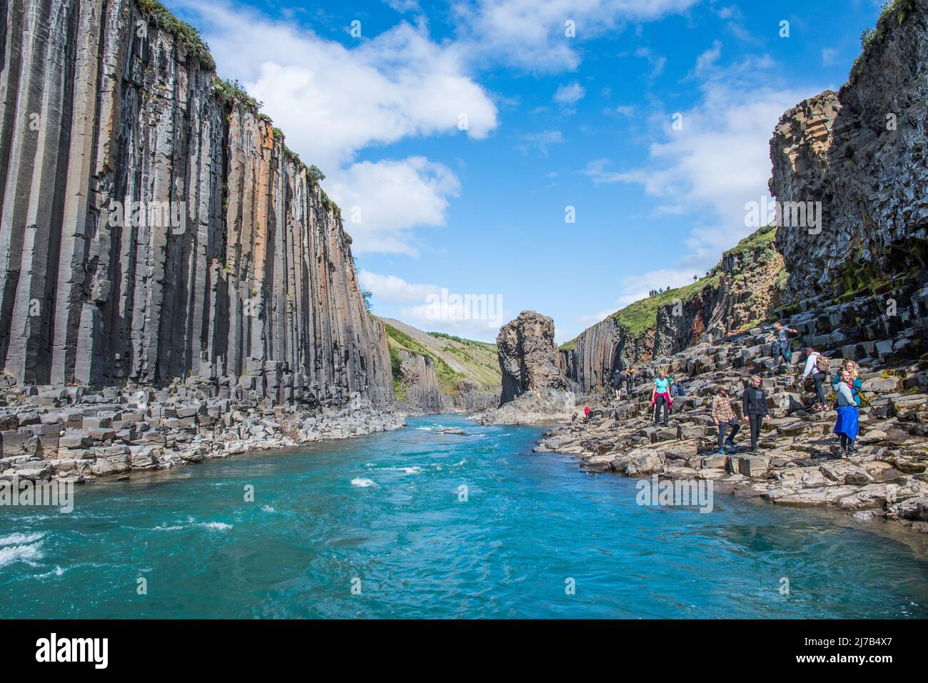 Studlagil Iceland - July 16. 2021: Tourists enjoying the stunning view ...