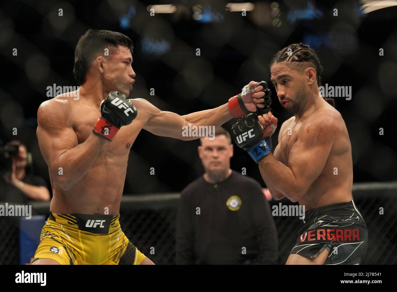 PHOENIX, AZ - MAY 7: (L-R) Kleydson Rodrigues punches C.J. Vergara in ...