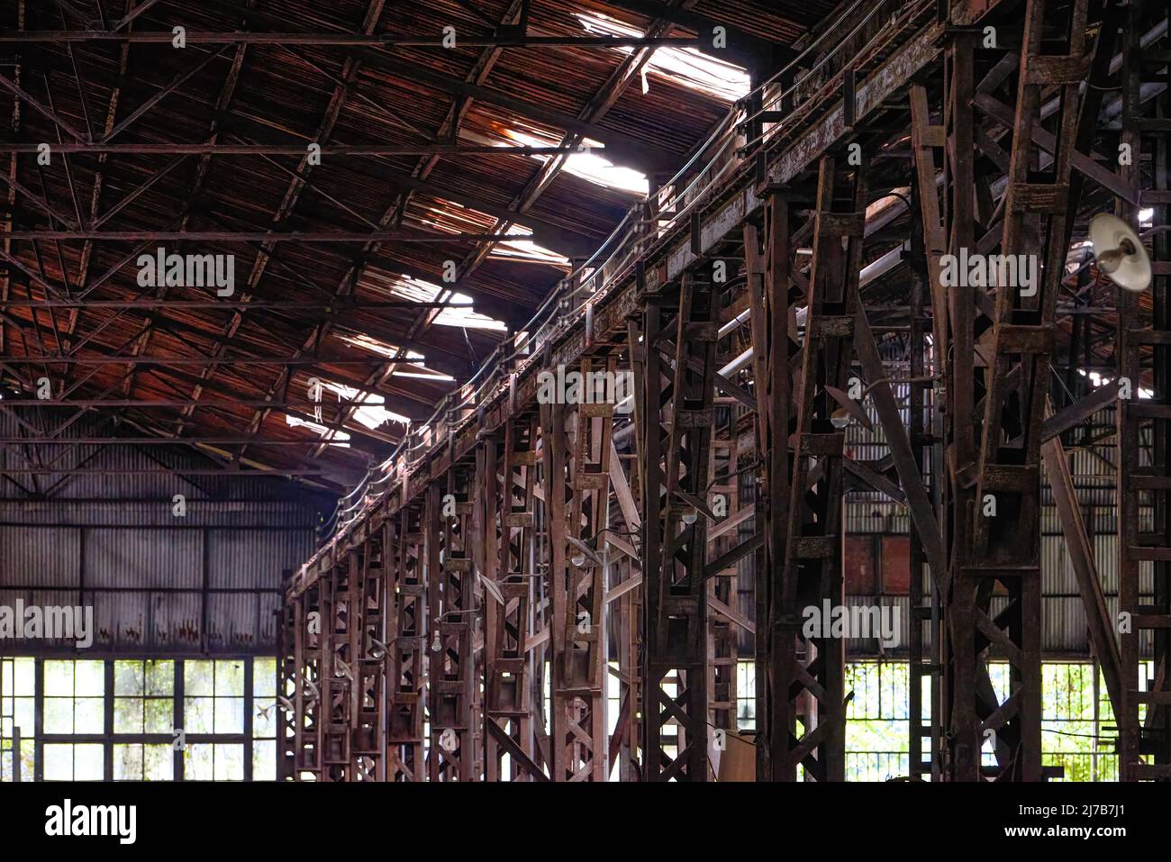 An abandoned steel frame structure automobile production workshop Stock ...