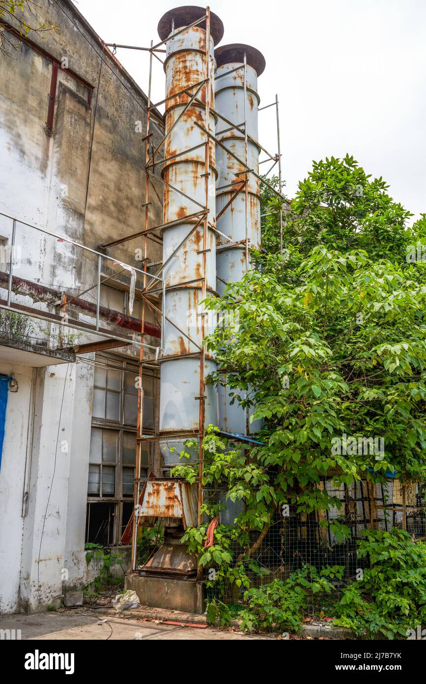 Close-up of distillation and cooling towers in an old industrial area ...
