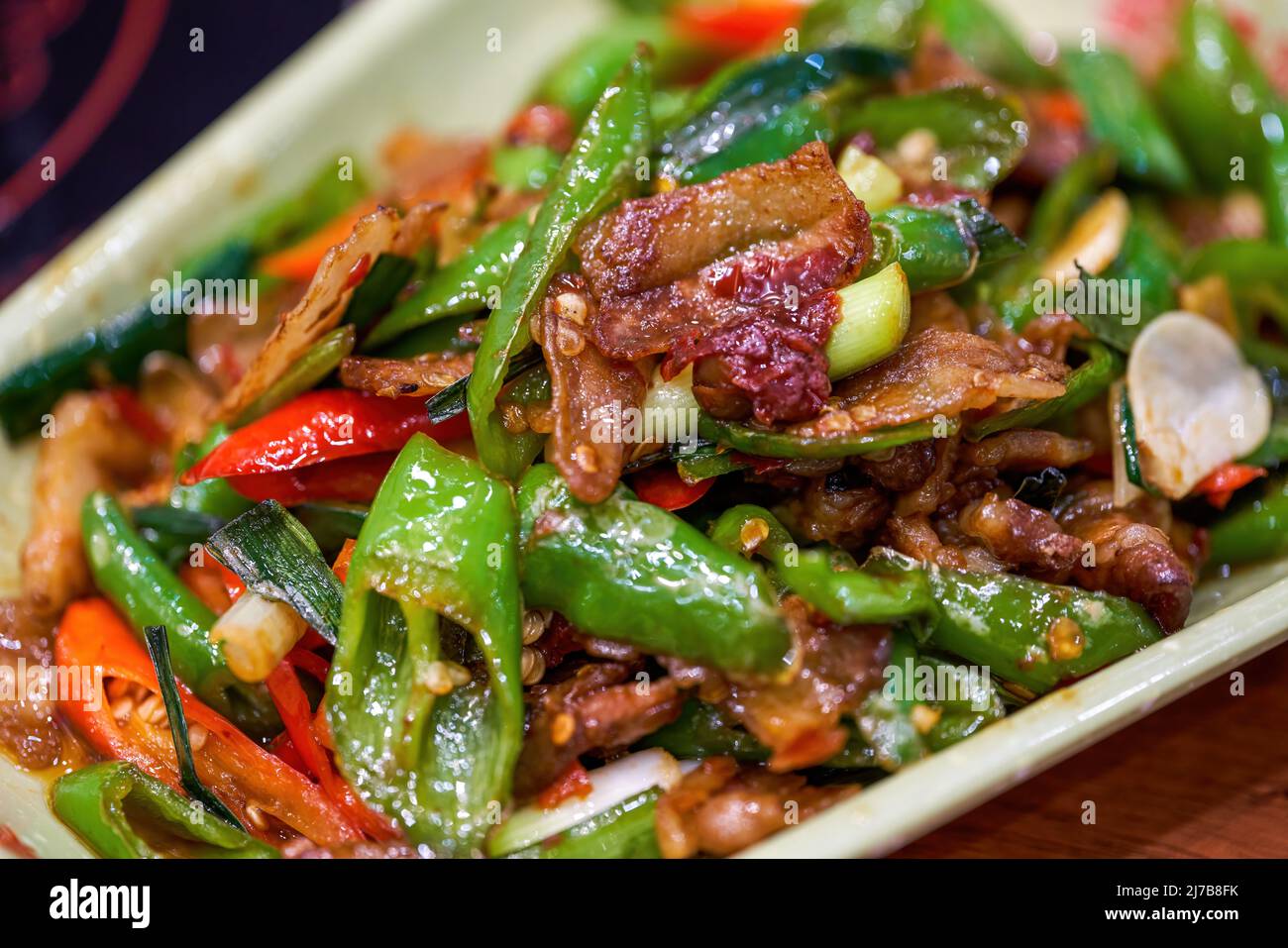 A delicious Chinese Hunan dish, stir-fried pork with chili Stock Photo ...