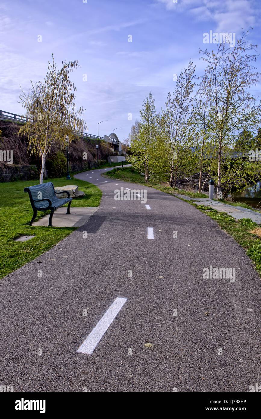 A bike and walking path in a park like setting in the downtown area of Sandpoint, Idaho Stock ...