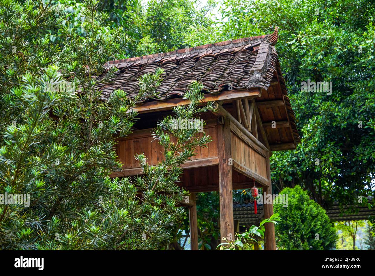 Wooden hut and tile roof in Chinese garden Stock Photo - Alamy