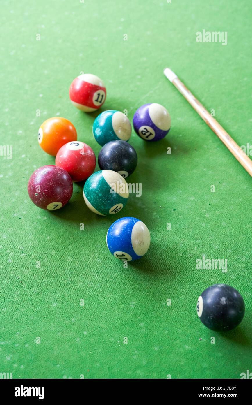 Billiards and pool cues on the pool table Stock Photo - Alamy