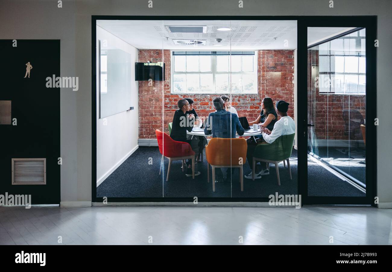 Group of businesspeople having an important meeting in a modern ...