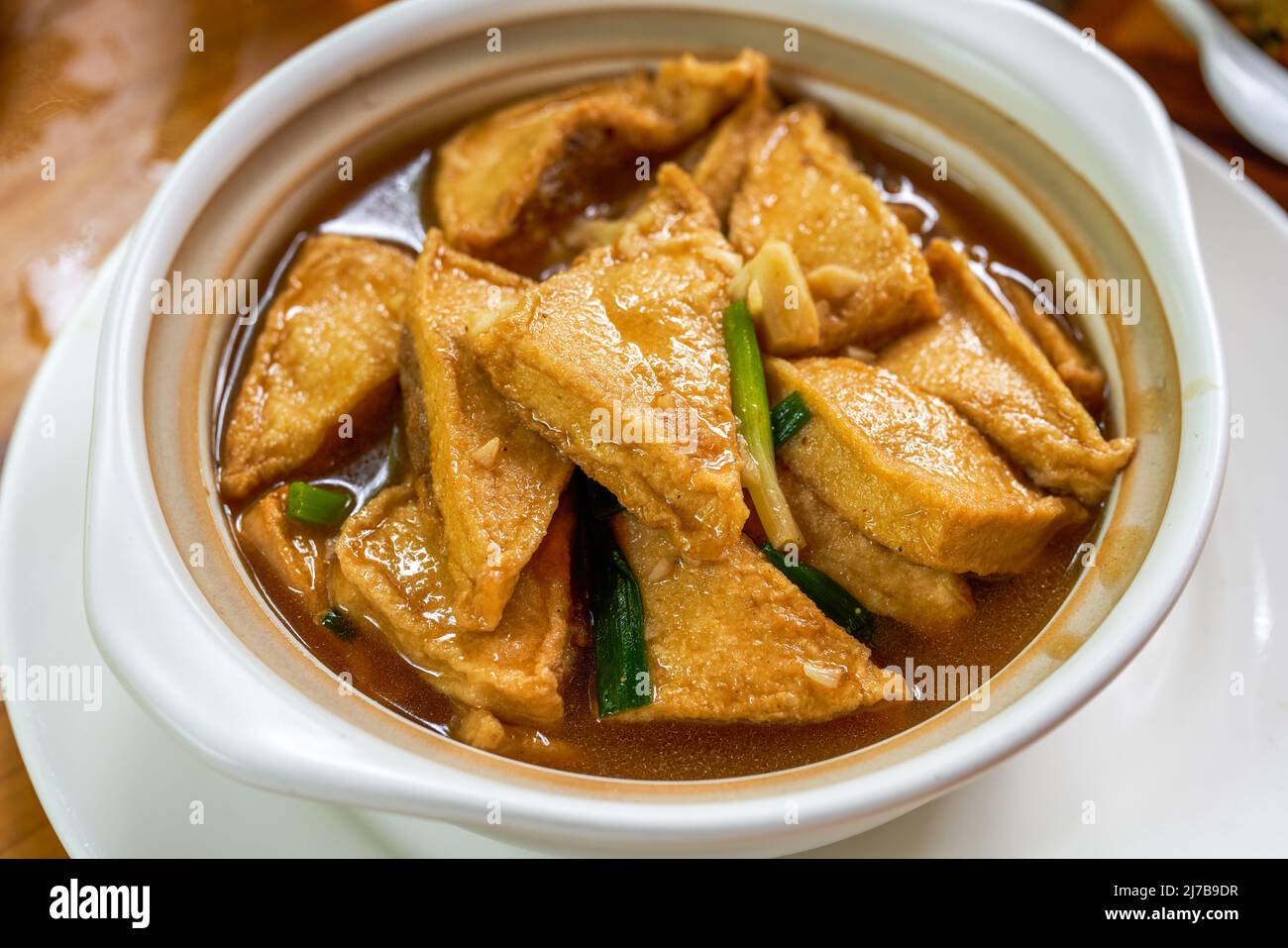 A delicious Chinese dish, braised tofu and stuffed meat in claypot ...