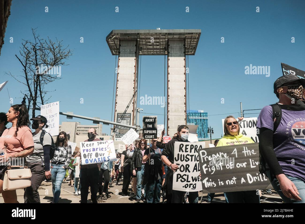 Protesters hold placards, chant, and march through downtown Detroit in ...